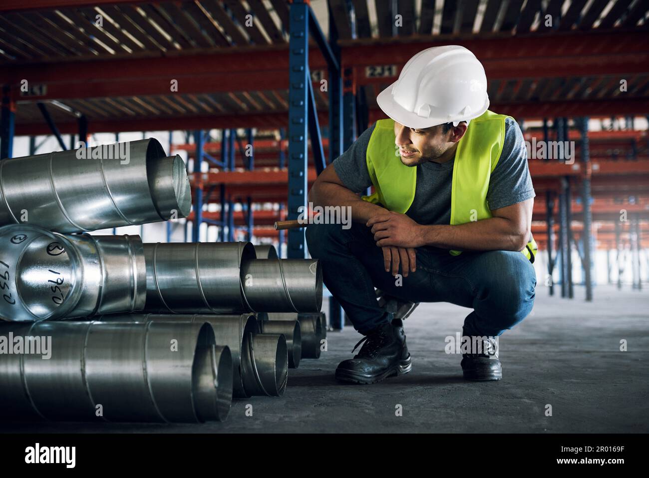 Its whats inside that counts. a young man doing inspections at a ...