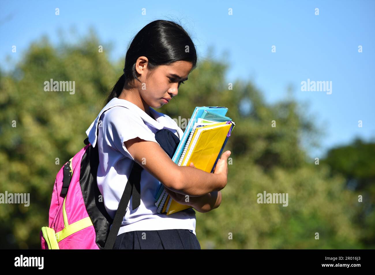 Filipina Girl Student And Sadness Wearing Bookbag With Textbooks Stock ...