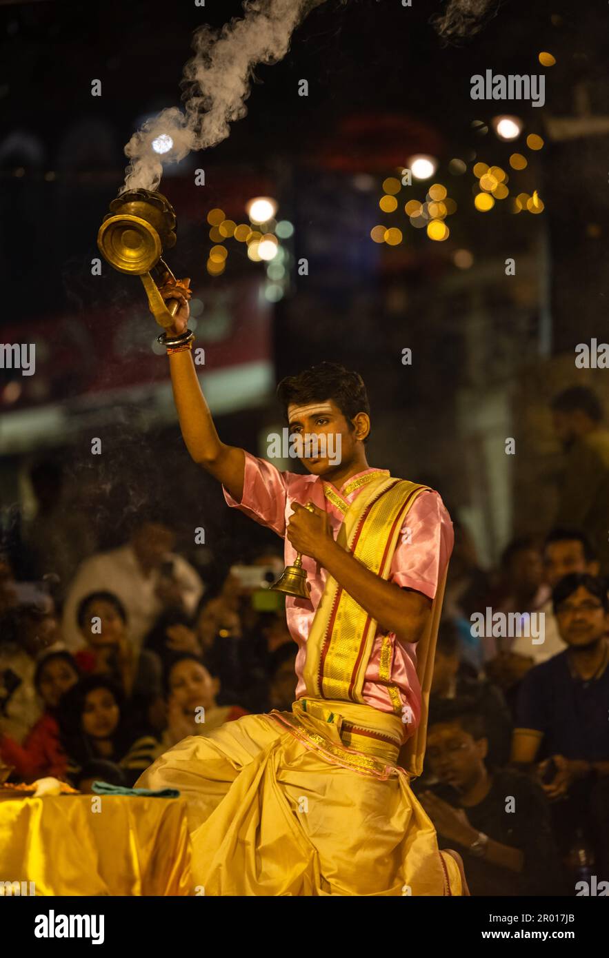 Ganga aarti, Portrait of an young priest performing river ganges ...