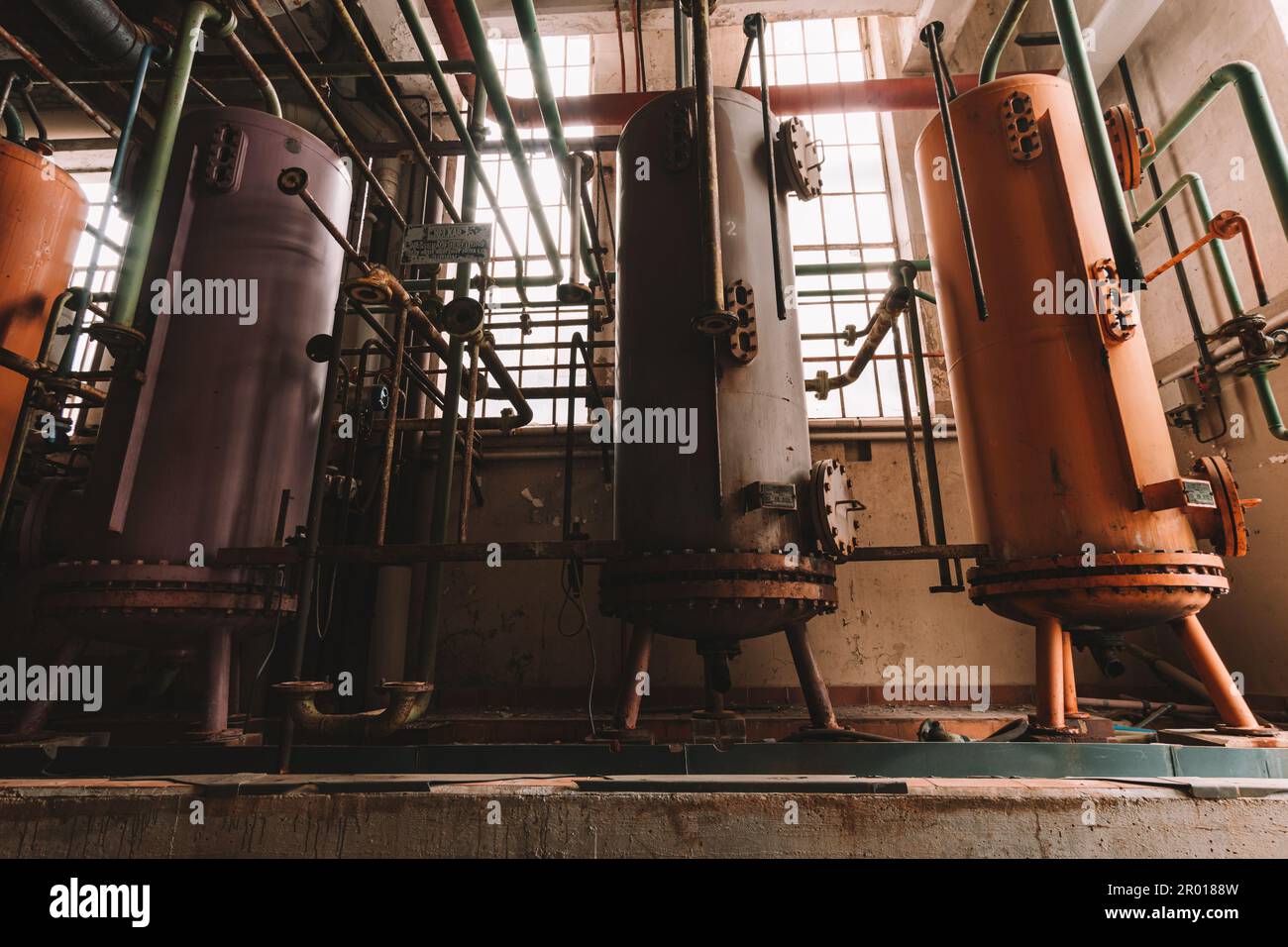 Old and rusty abandoned industrial plant, forgotten historical factory ...
