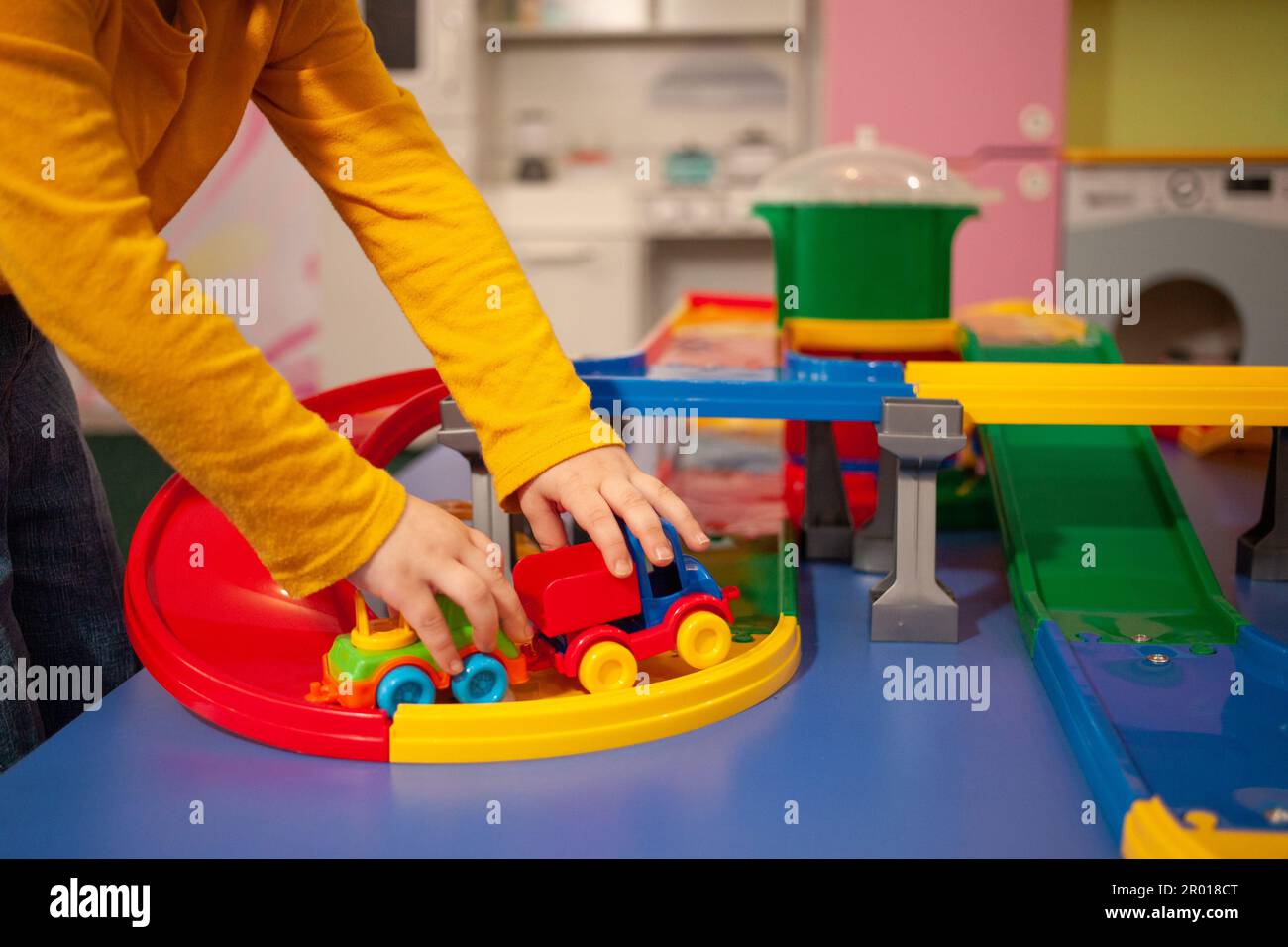 child in kindergarten, playroom, playing with toys, learning. Plays ...