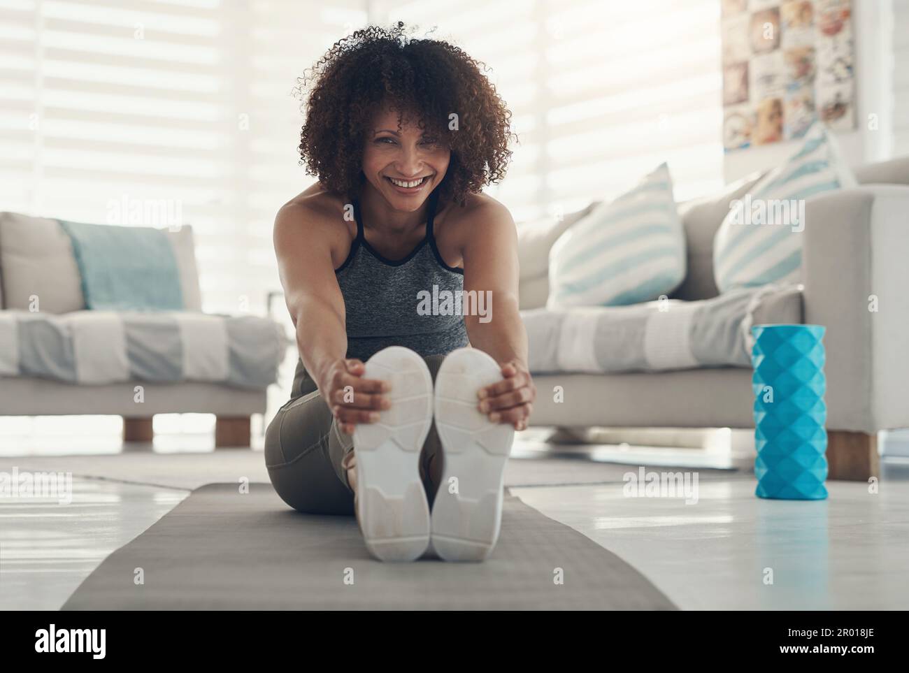 Im smiling but my muscles are crying. an attractive young woman sitting ...