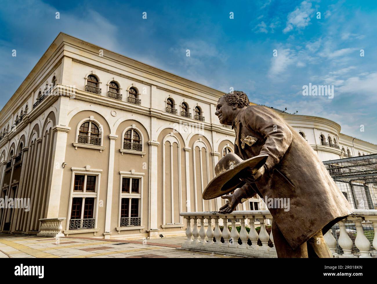 Building of Macedonian National Theater with a statue of an actor in ...