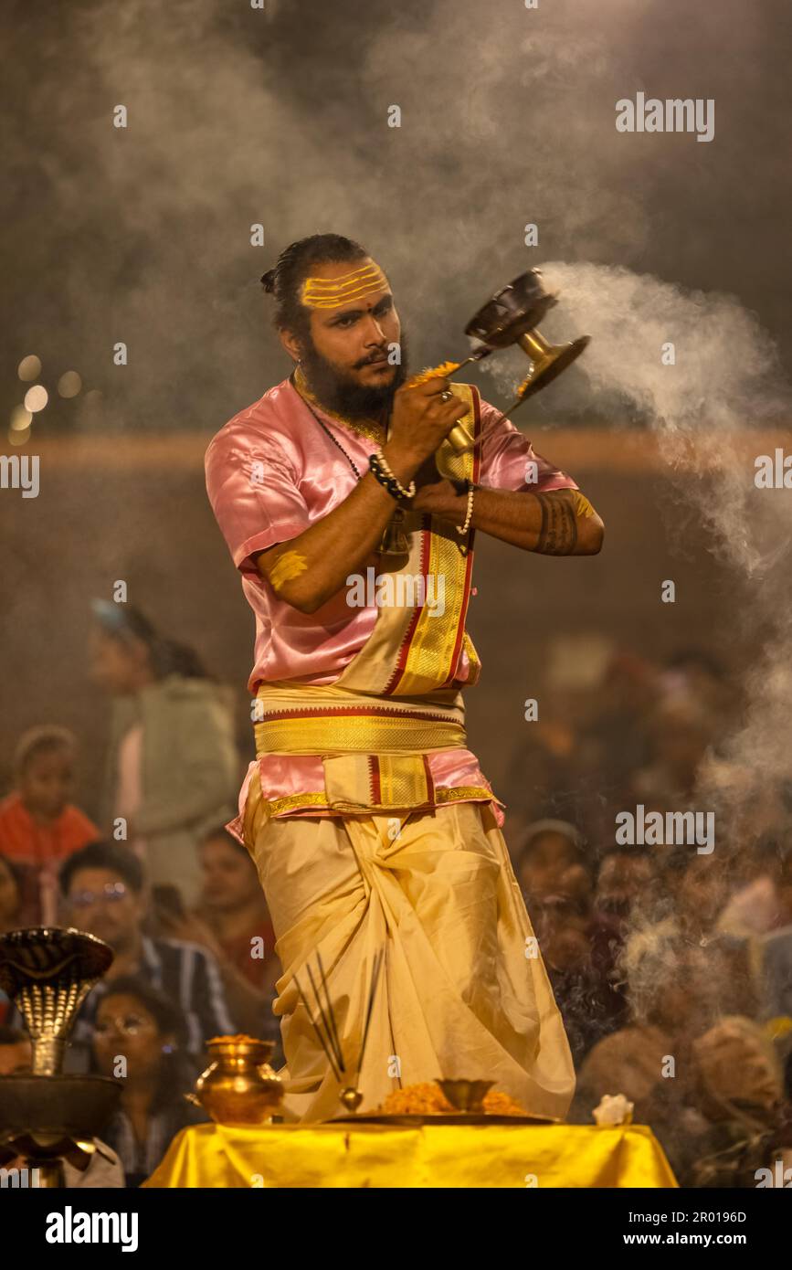 Ganga aarti, Portrait of an young priest performing river ganges ...