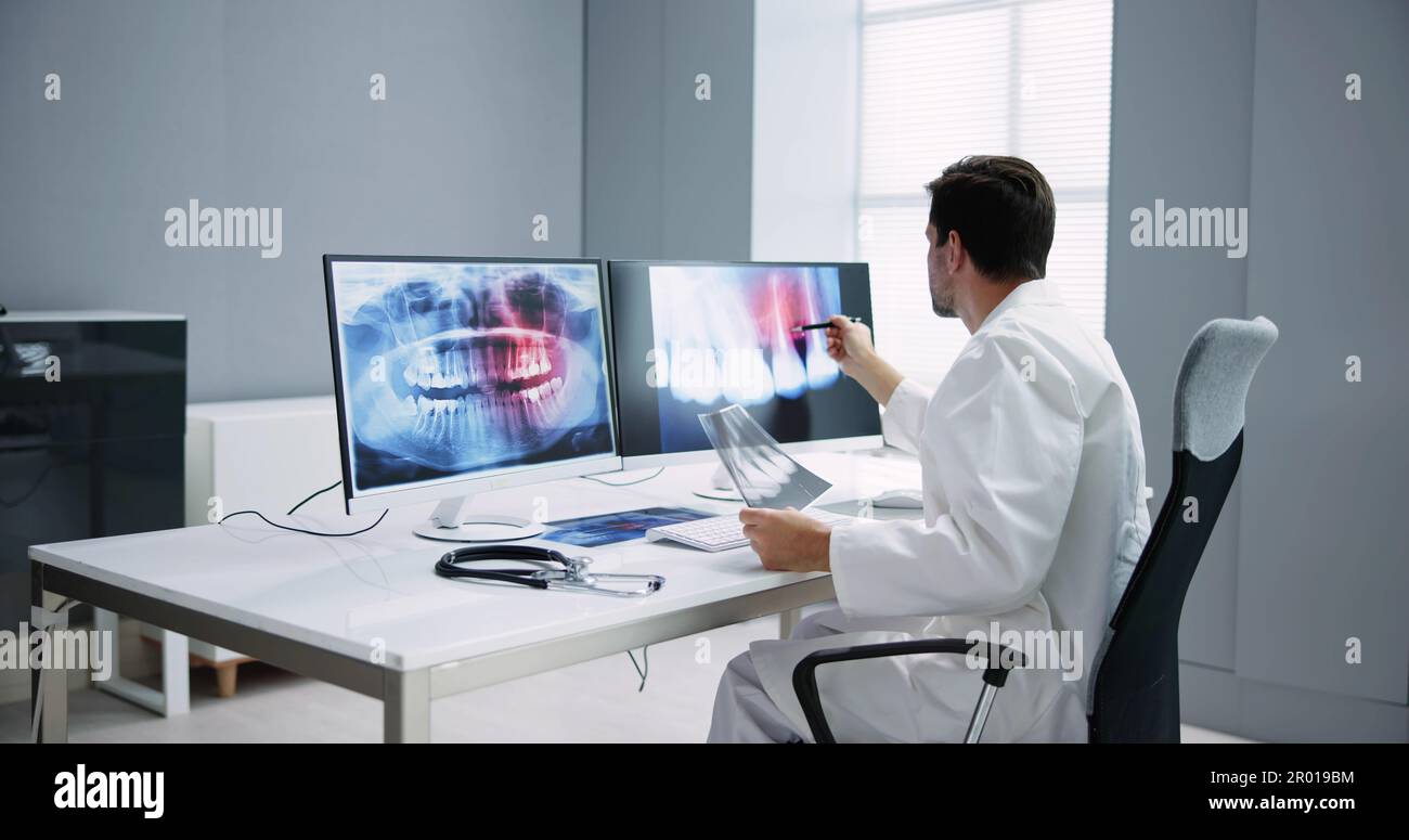 Radiologist Dentist Using X Ray Software On Desktop Computer Stock ...