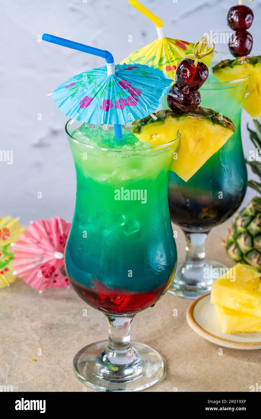 Colorful rainbow Sunshine Lagoon tequila cocktail Stock Photo - Alamy