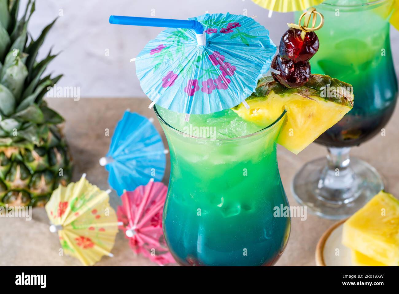 Colorful rainbow Sunshine Lagoon tequila cocktail Stock Photo - Alamy