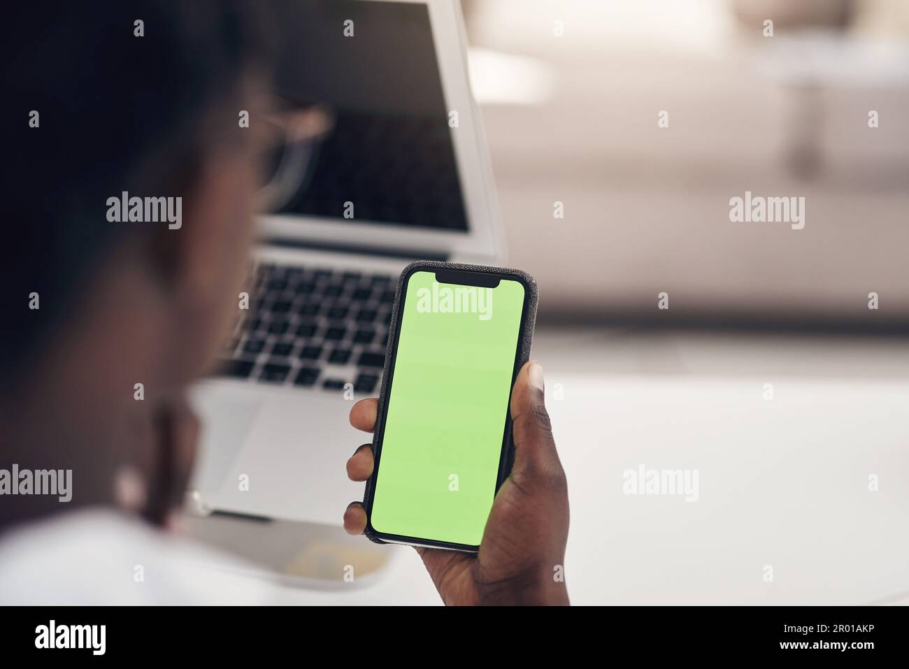 Optimising your webpage for cellphones. an unrecognizable businesswoman ...