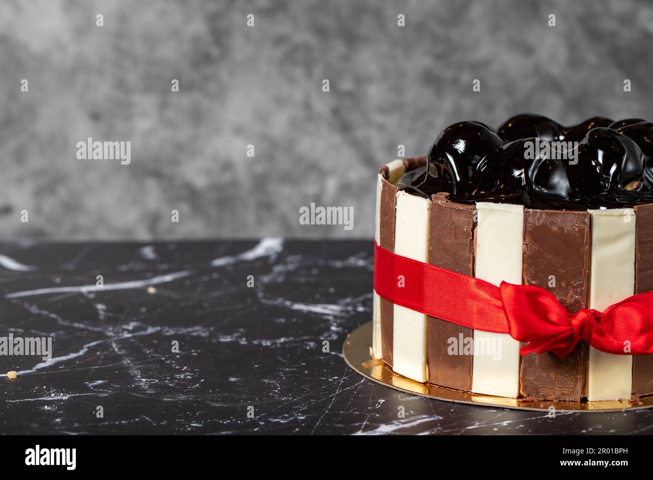 Cake with profiteroles and chocolate cream. Birthday or celebration ...