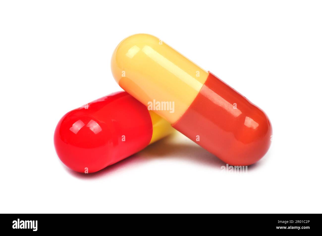 two colorful capsules on a white background Stock Photo - Alamy