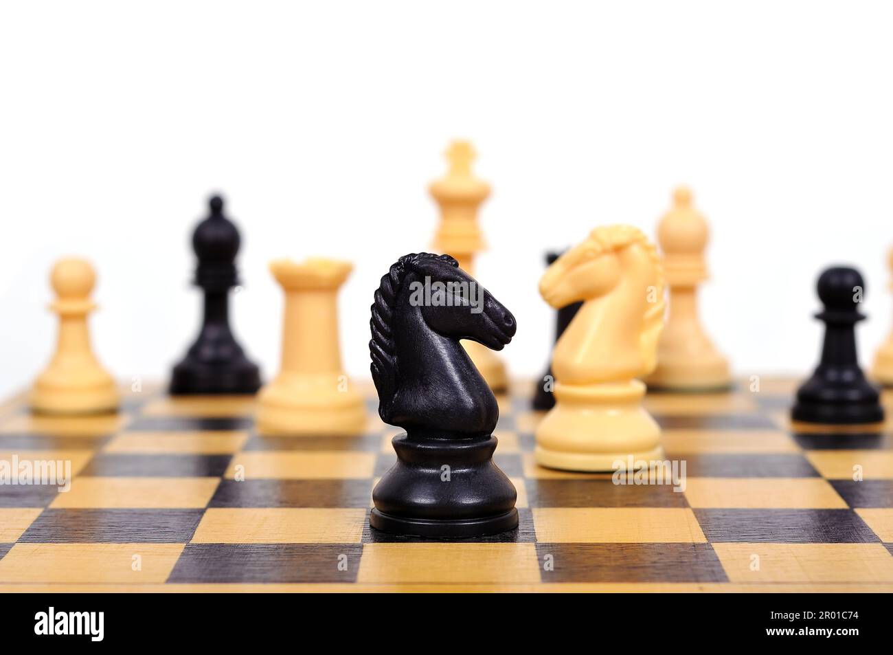 black chess knight on a chess board Stock Photo - Alamy
