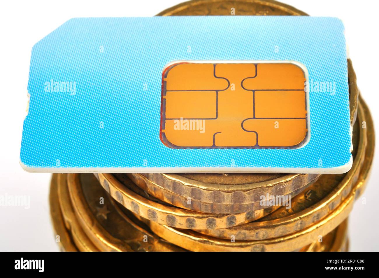 blue sim card and euro coins money, close up Stock Photo - Alamy