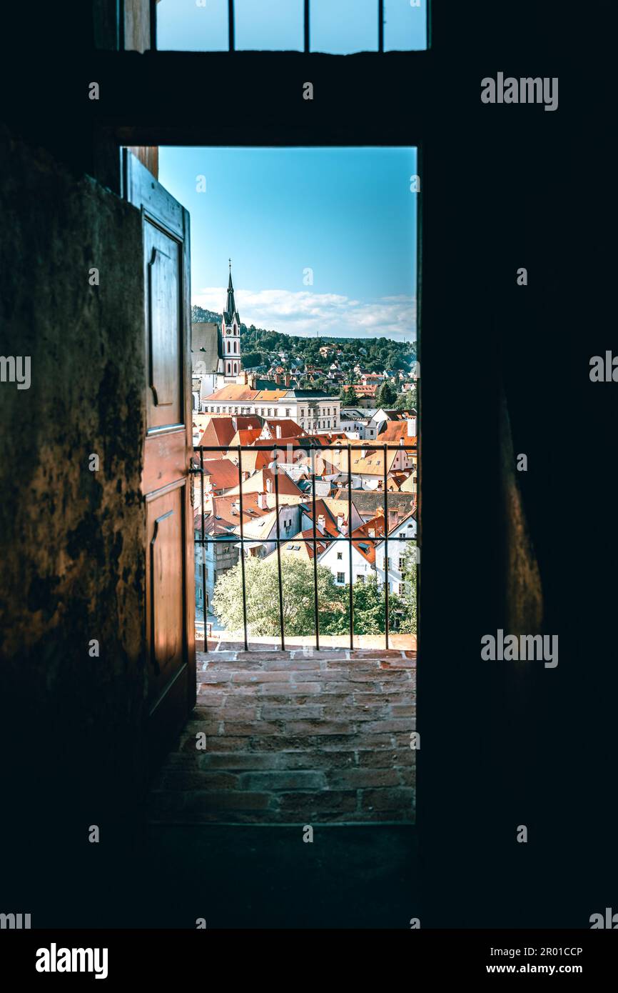 Open door at the castle with a view on the medieval town Stock Photo ...