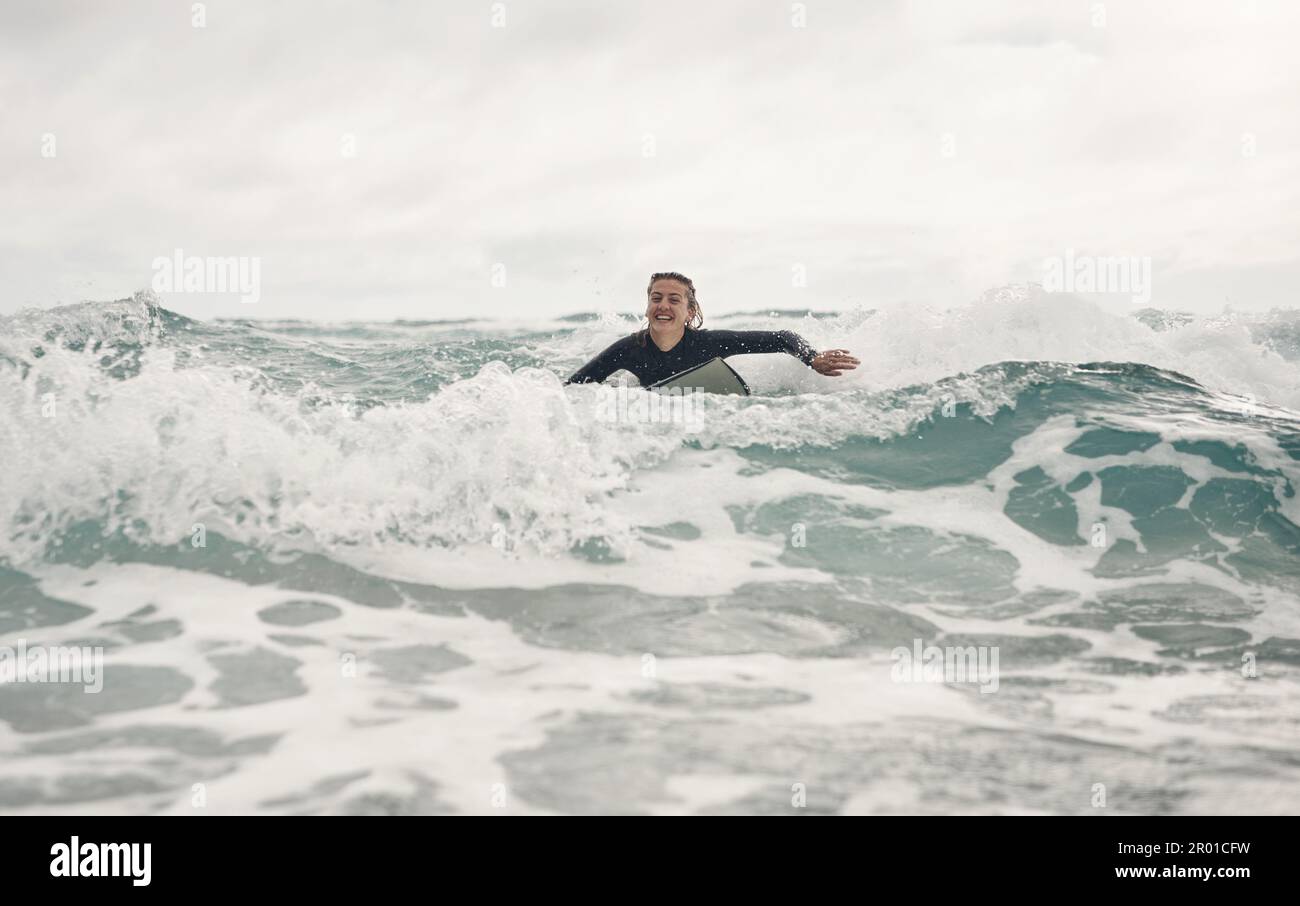 Youll never forget the feeling of riding a wave. a young woman out ...