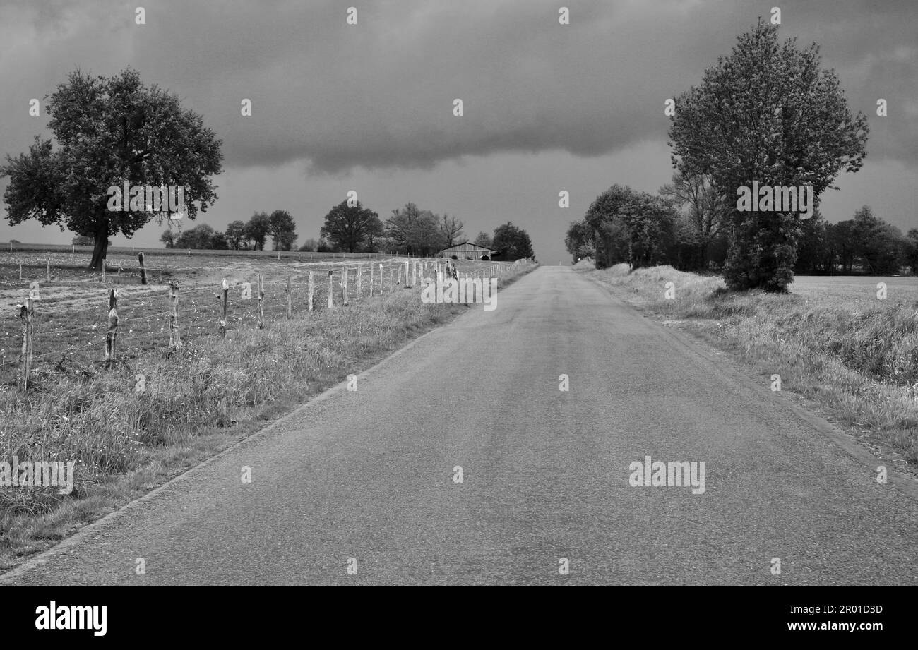 A cloudy sky over Barenton, in the French countryside, Normandy, France ...