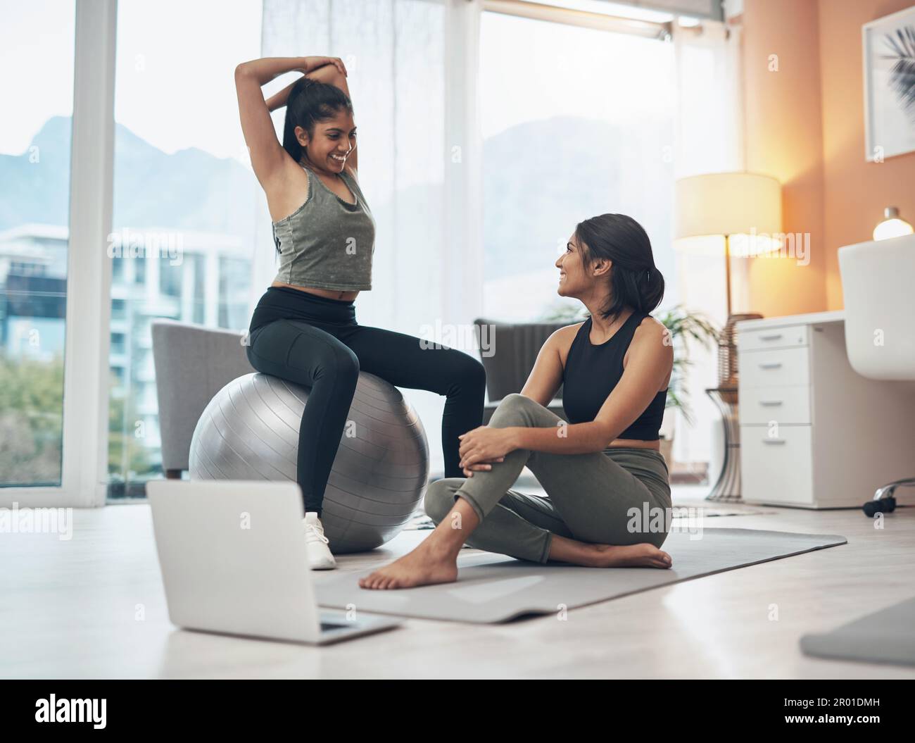 Are you ready to go live. two young women working out at home Stock ...
