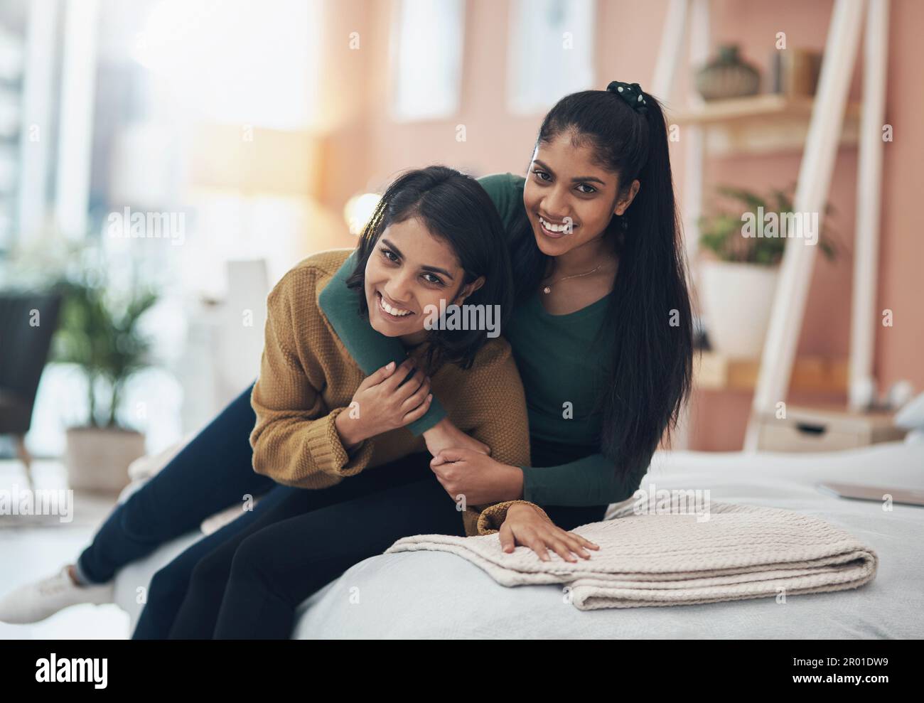 Were always teasing each other. two happy young women sitting together ...