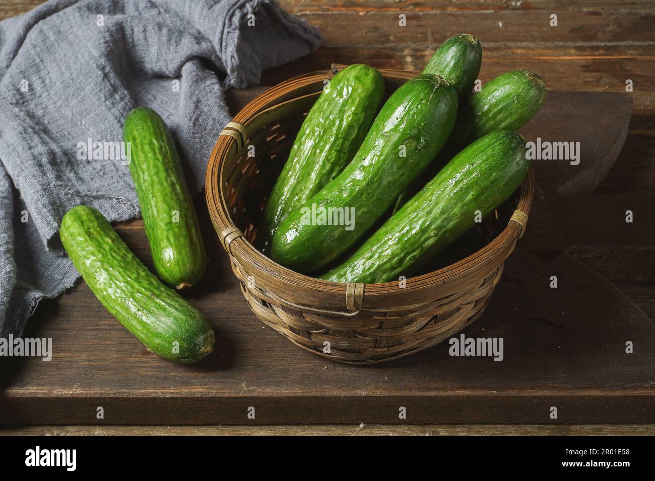 Fresh crunchy mini cucumbers in a basket Stock Photo - Alamy