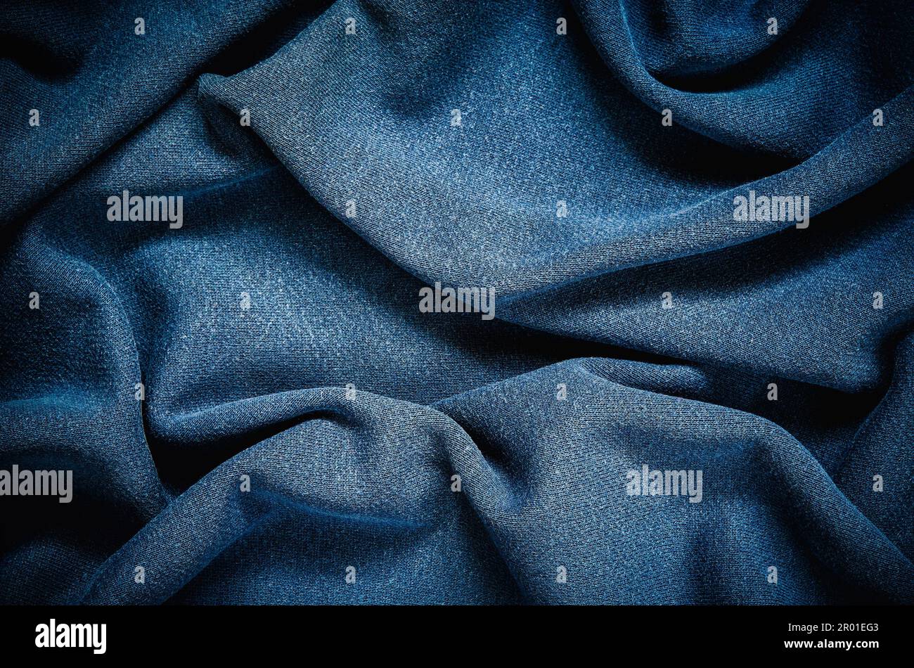 Navy blue wrinkled fabric texture. Close-up of soft cotton cloth, may ...