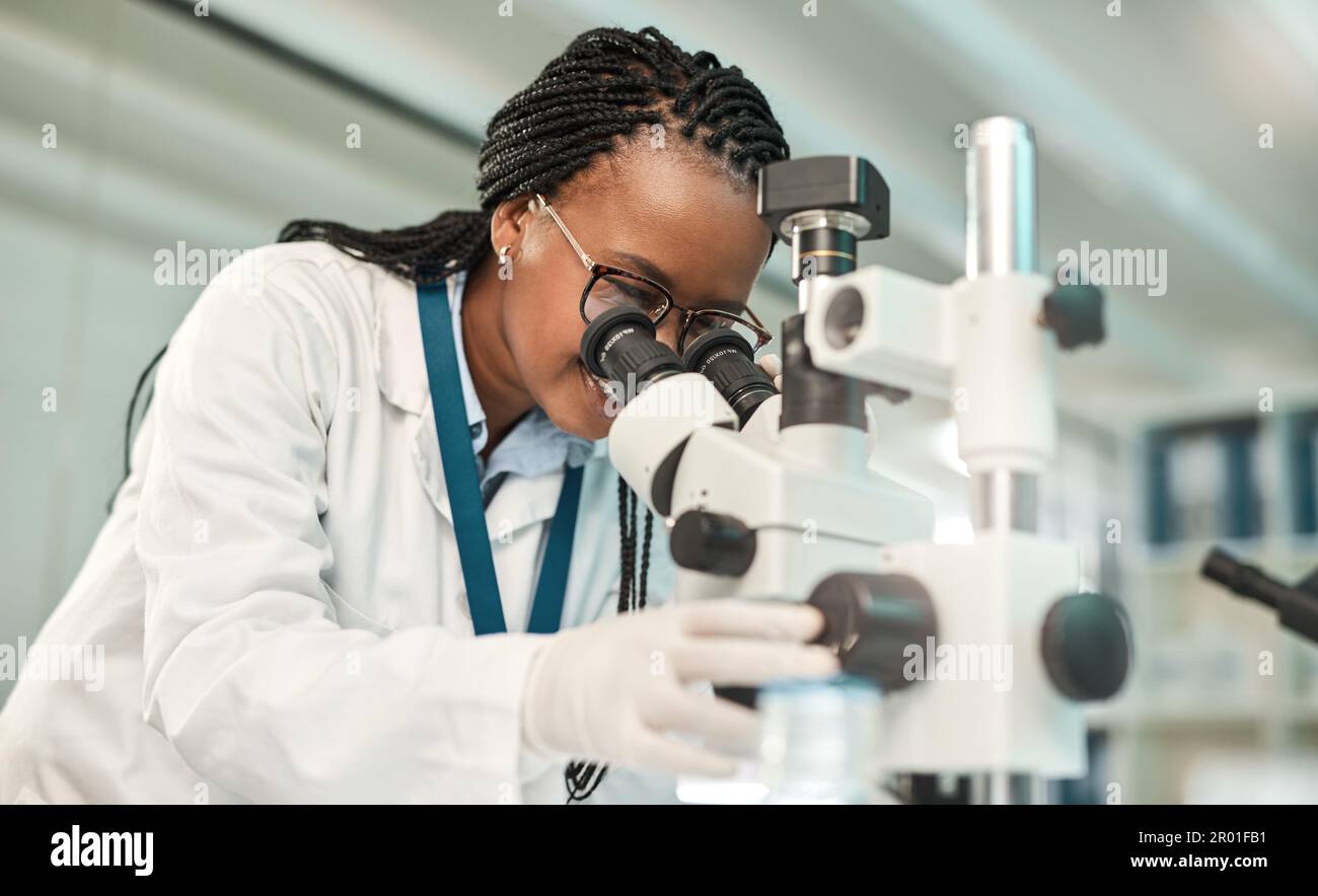 What have I discovered here. a young scientist using a microscope in a ...