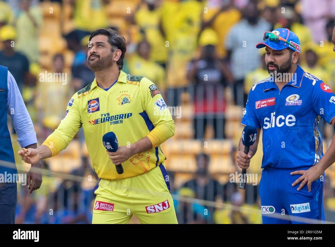 Chennai Super Kings' captain MS Dhoni, left, tosses a coin as Mumbai ...