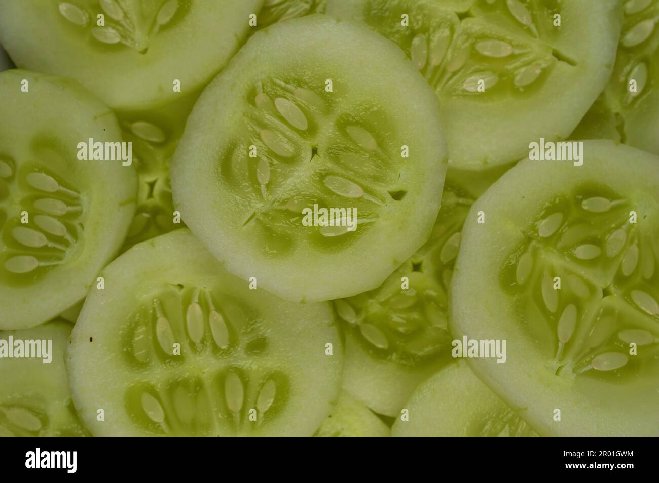 Fresh cucumber pieces forming a beautiful texture pattern background ...