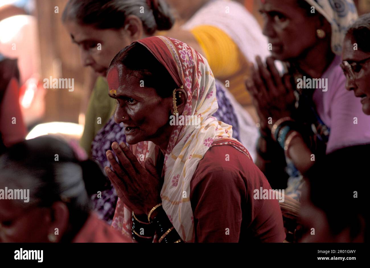 indian women at a temple in the city centre of Mumbai in India. India ...