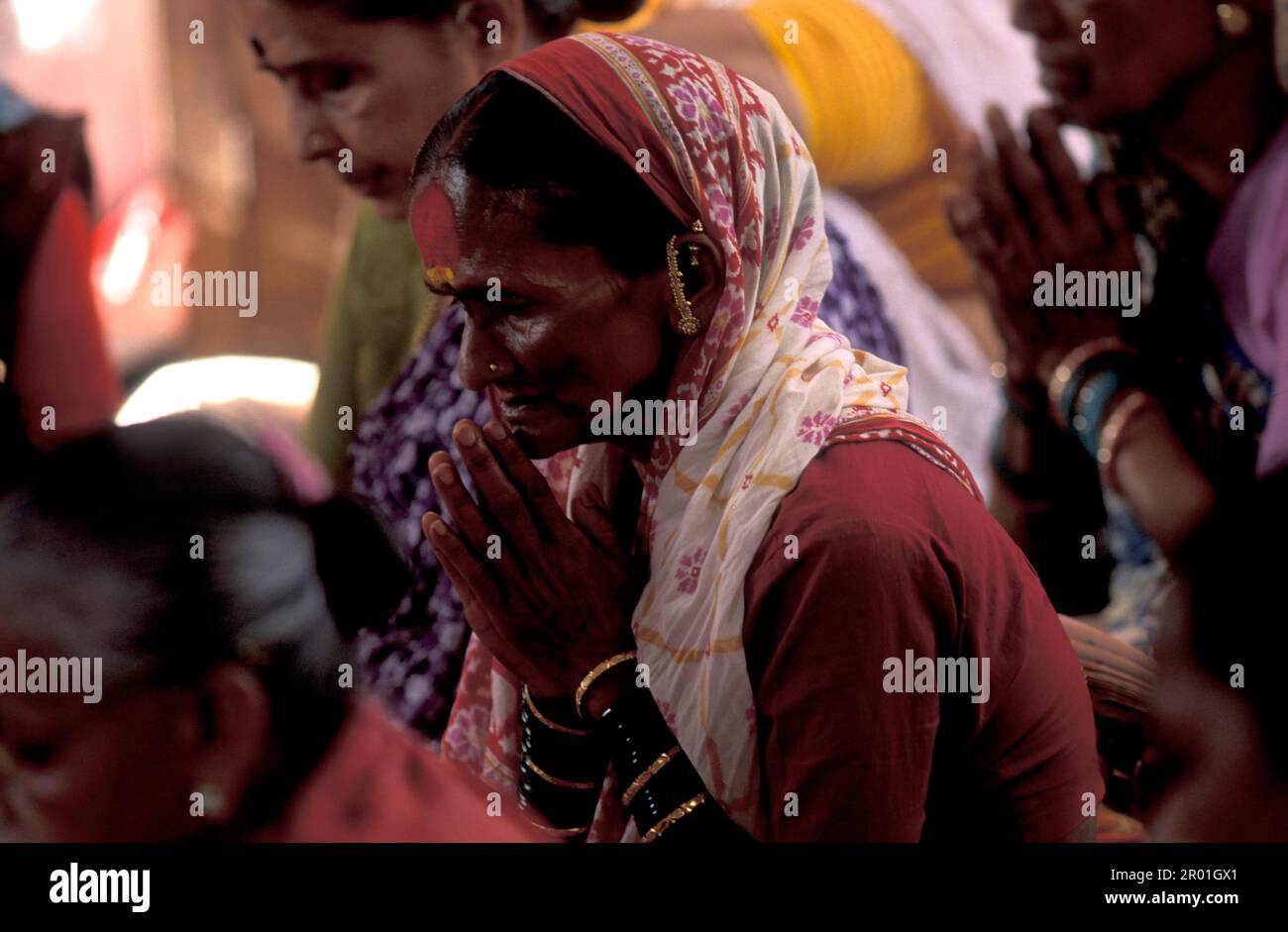 indian women at a temple in the city centre of Mumbai in India. India ...