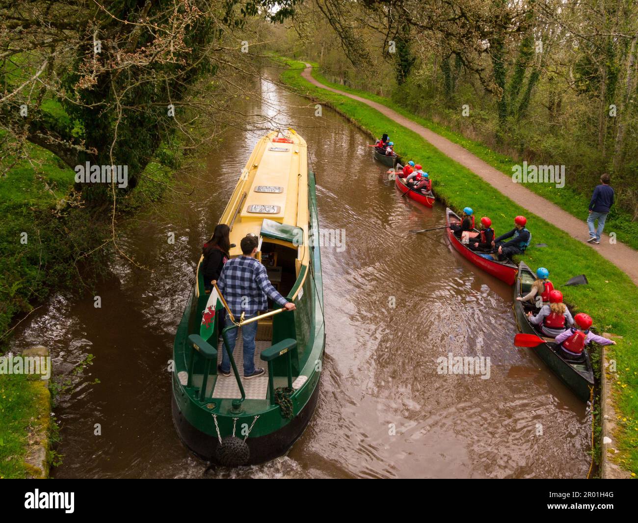 Holding canoes on side of monmouthshire and brecon canal hi-res stock ...