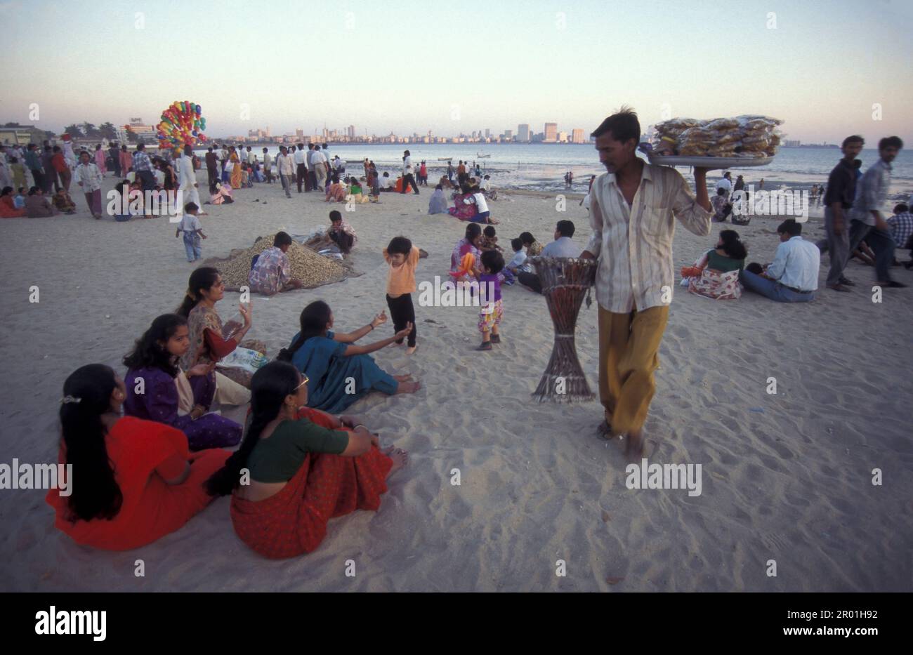 people at the Chowpatta Beach in the city centre of Mumbai in India ...