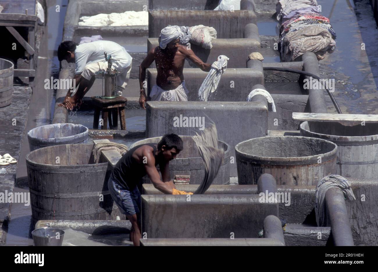 workers at the outdoor Laundry Dhobi Ghat at Mahalaxmi in the city ...