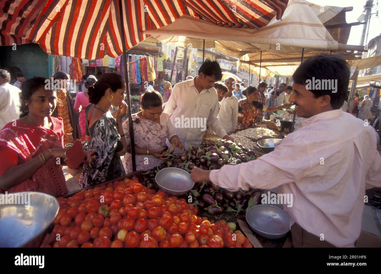 fresh vegetable at a market street with shops and People in the city ...