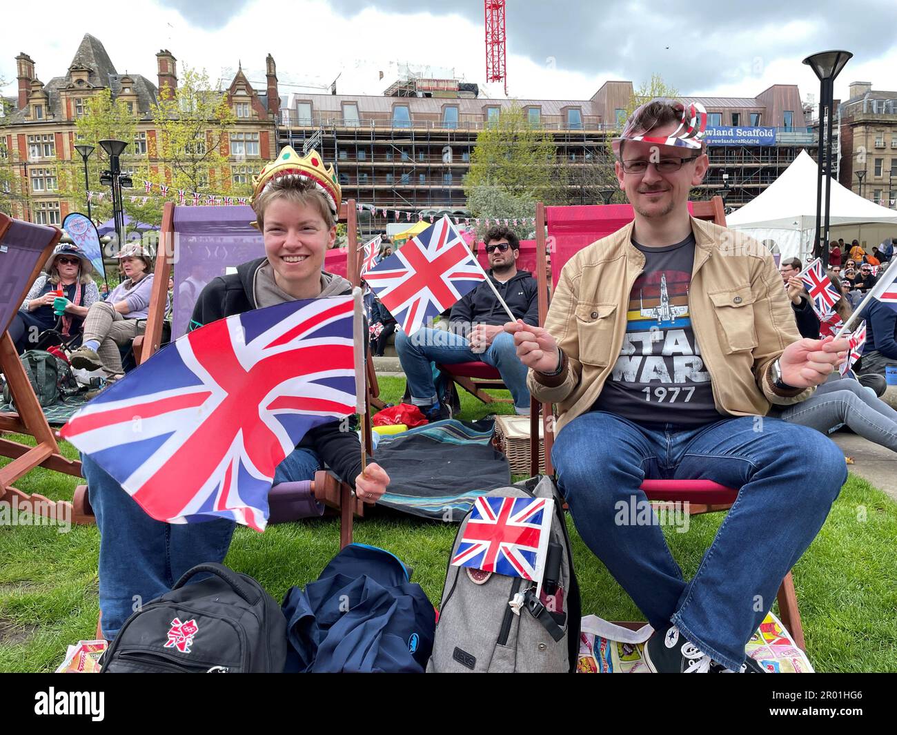 People watching the coronation ceremony of King Charles III and Queen ...