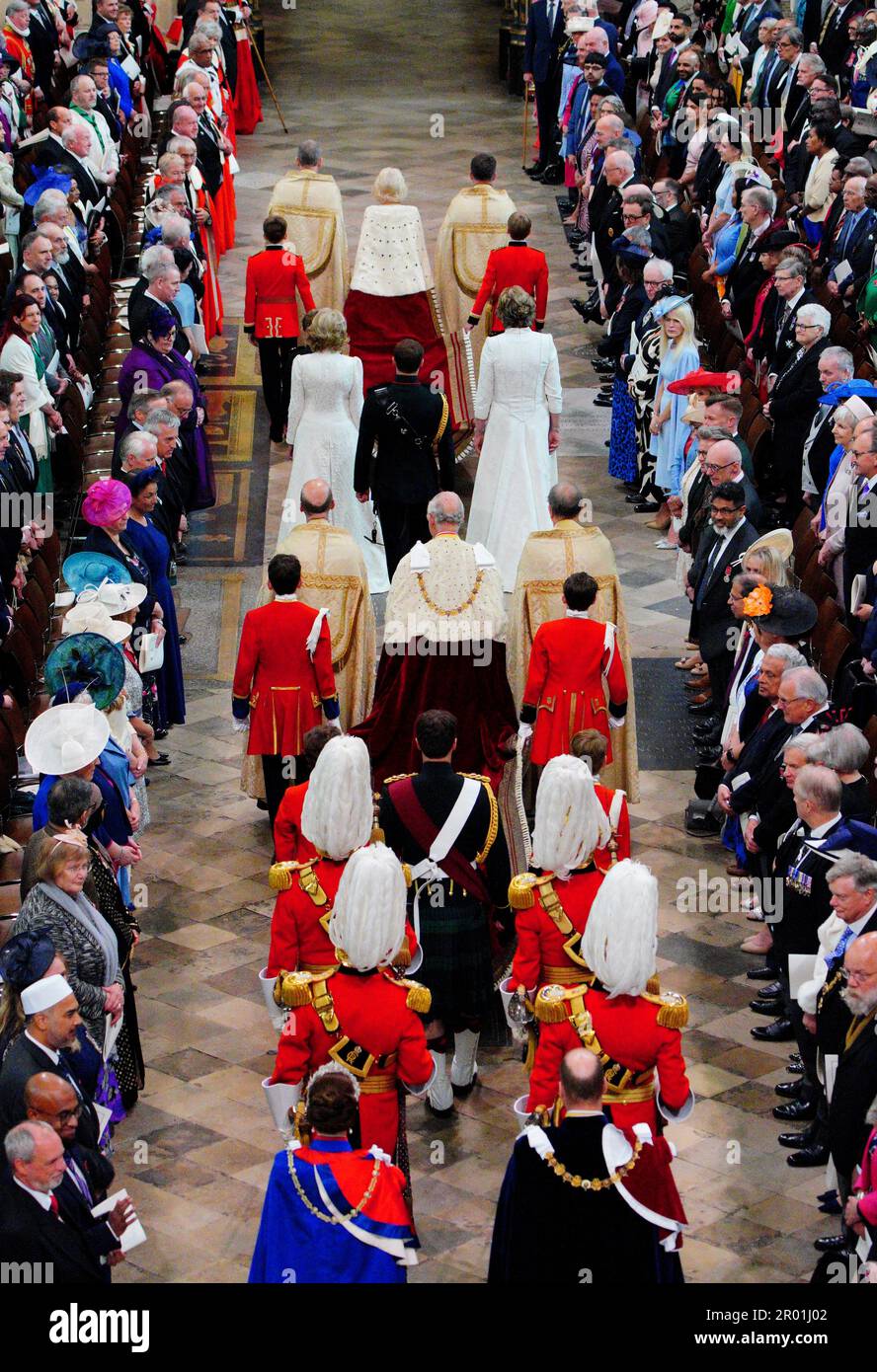 King Charles III follows Queen Camilla as they arrive for their ...