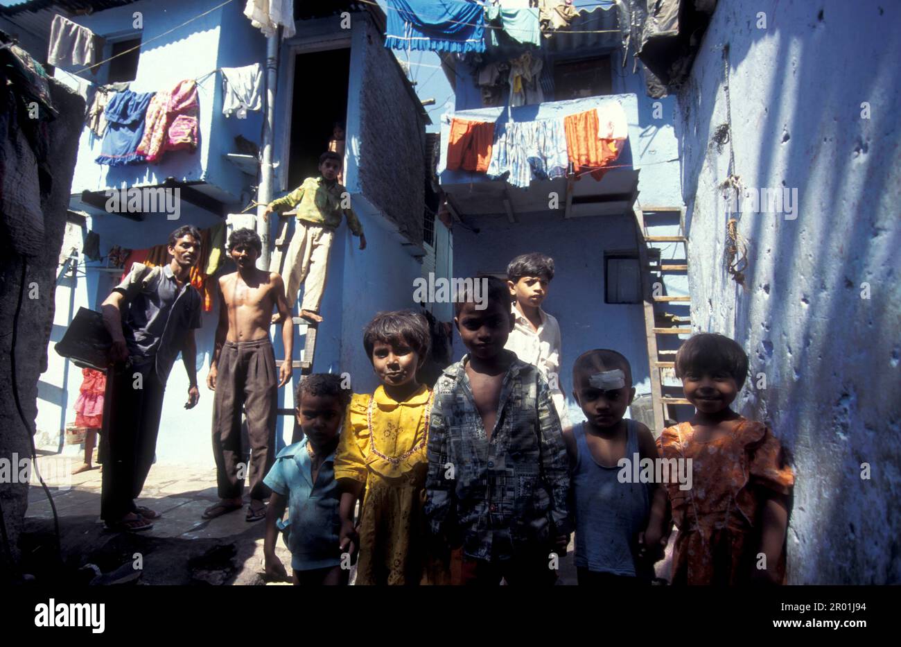 people and daily life at a village centre of a slum in the city centre ...