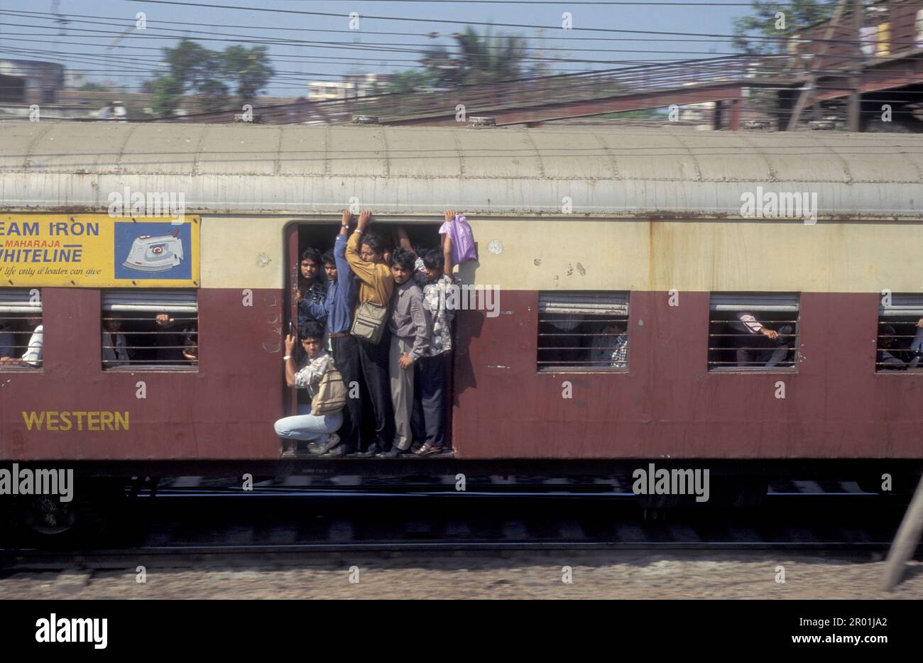 a overloaded Train on the way to the Mumbai Railway Station or ...