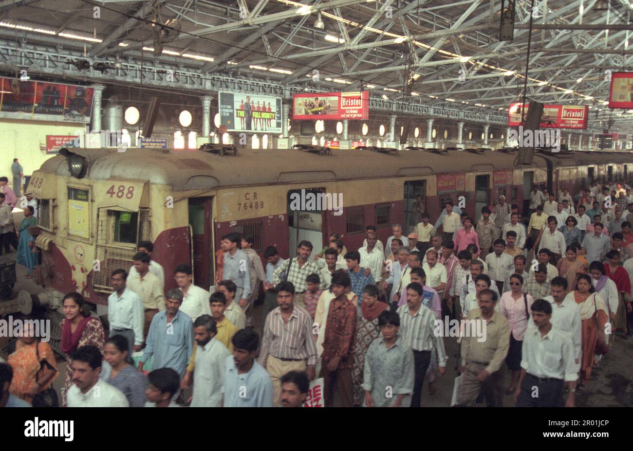 People and trains inside of the Mumbai Railway Station or Chhatrapati ...