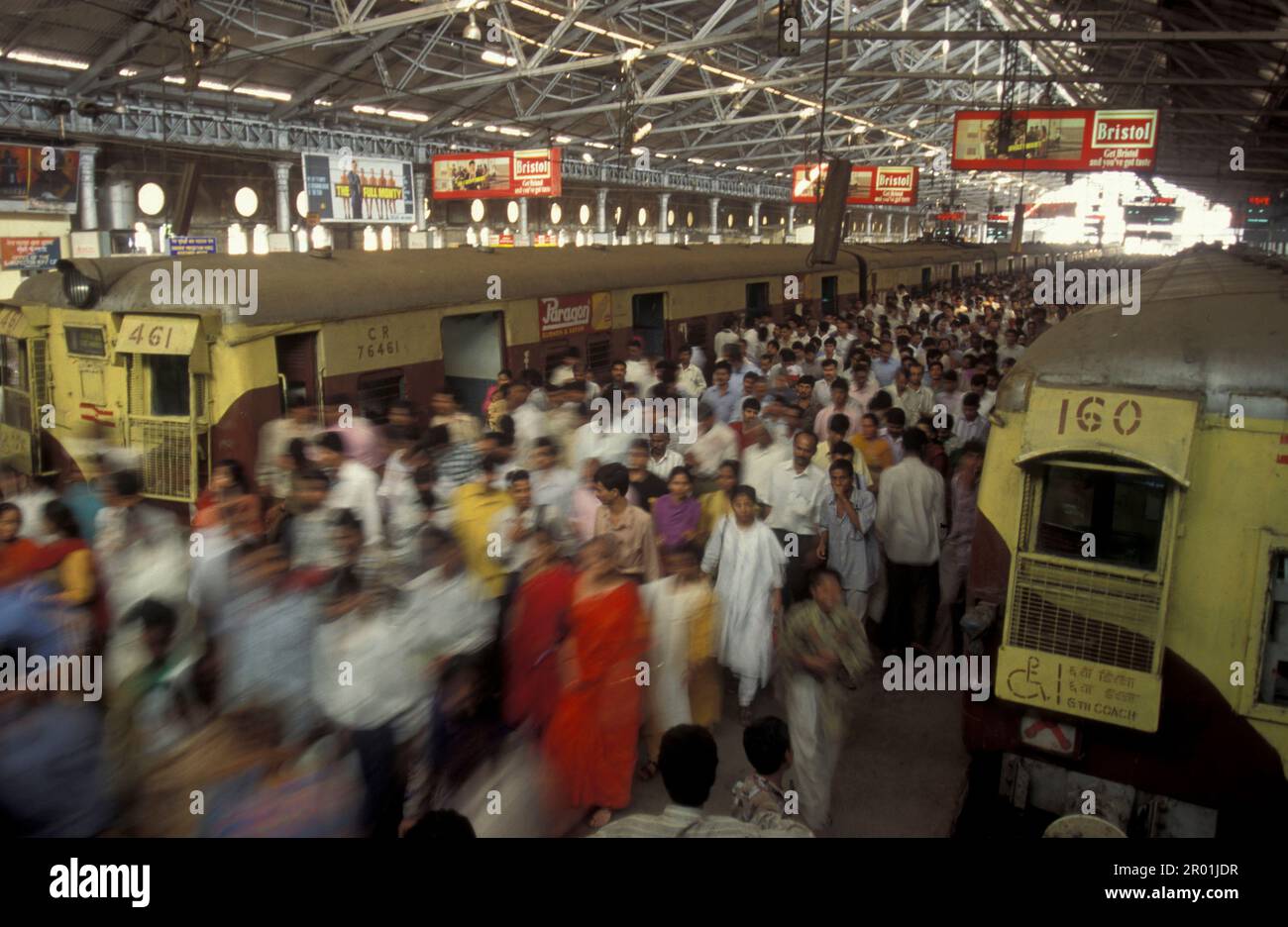 People and trains inside of the Mumbai Railway Station or Chhatrapati ...