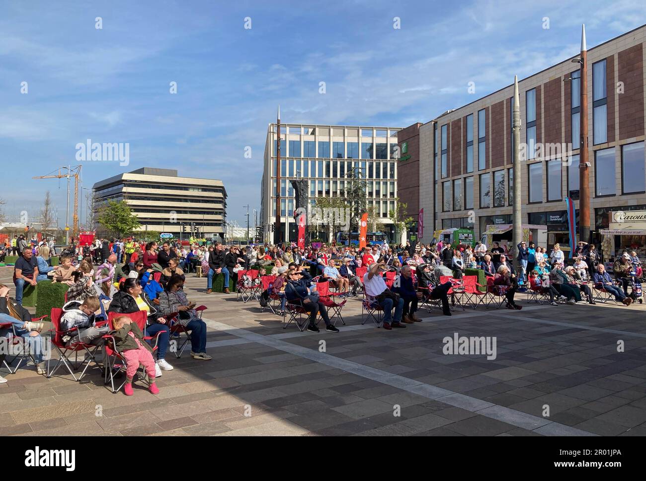 People watching the coronation ceremony of King Charles III and Queen ...