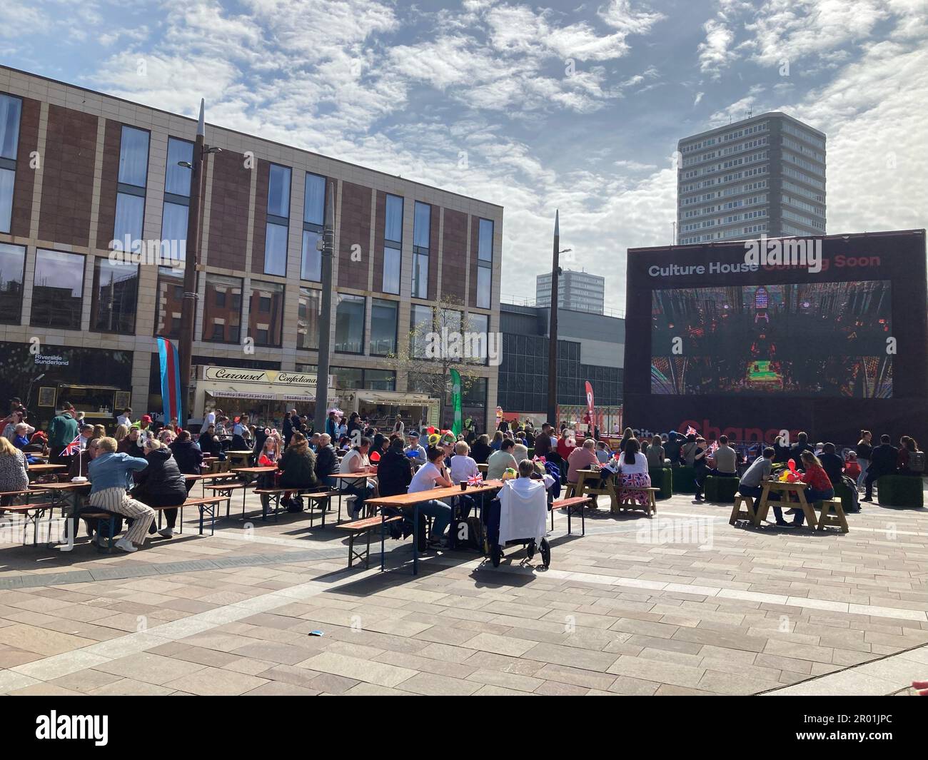 People watching the coronation ceremony of King Charles III and Queen ...