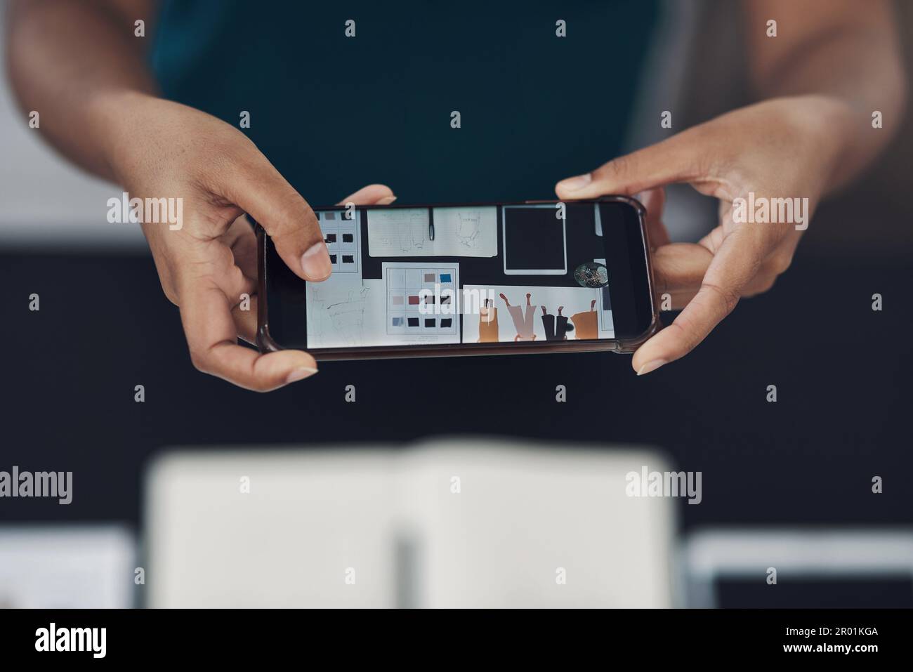 Taking snapshots of her work to show a client. Closeup shot of an ...