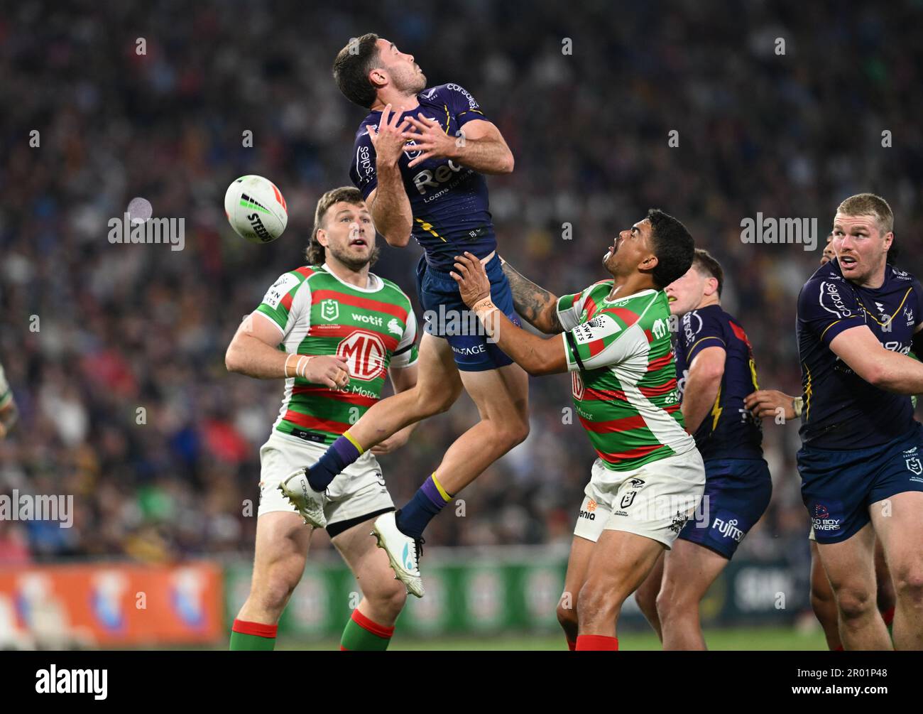 Nick Meaney (centre) of the Storm drops the ball during the NRL Round ...