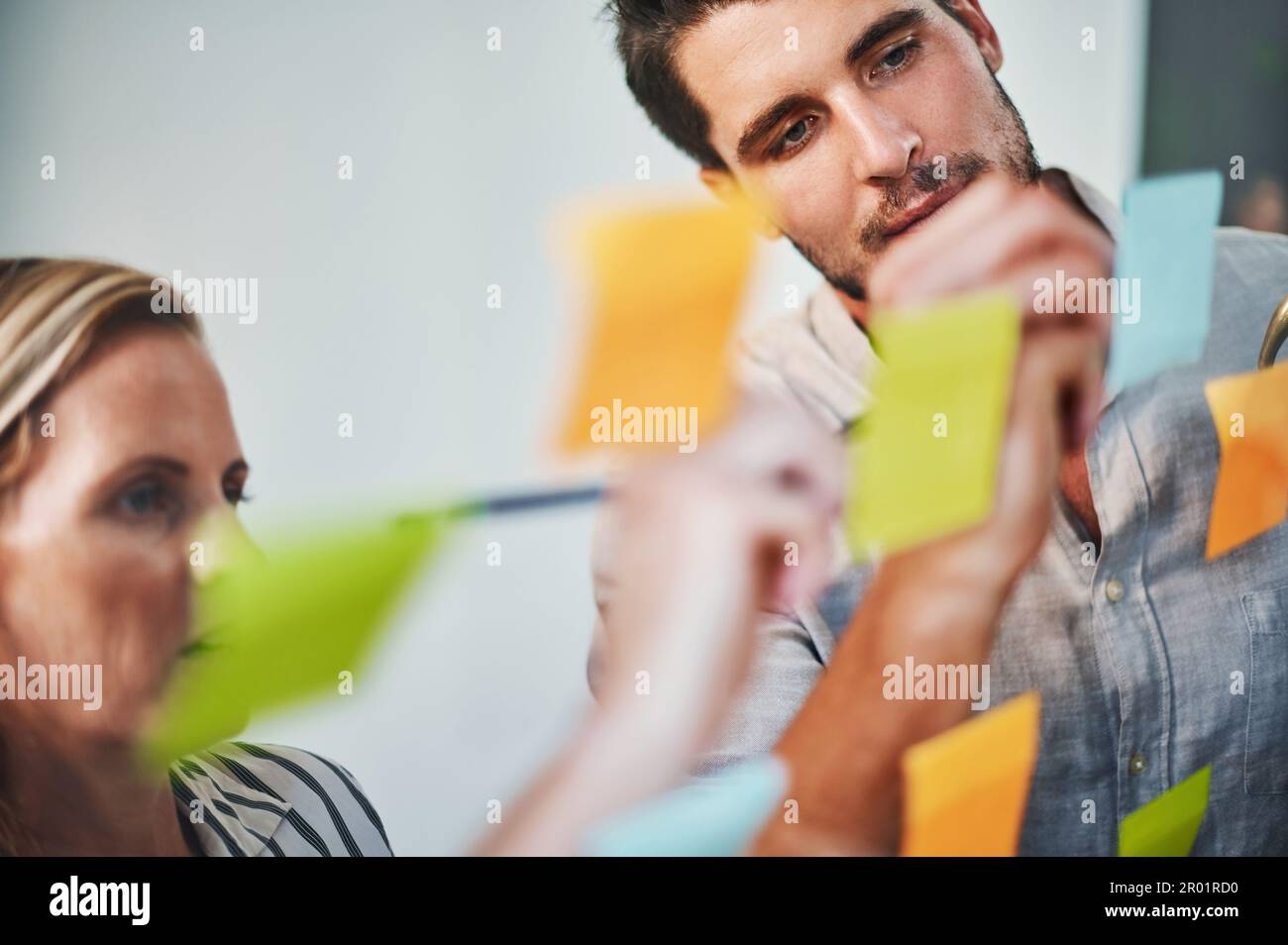 Comparing notes and coming up with ideas. two business colleagues ...