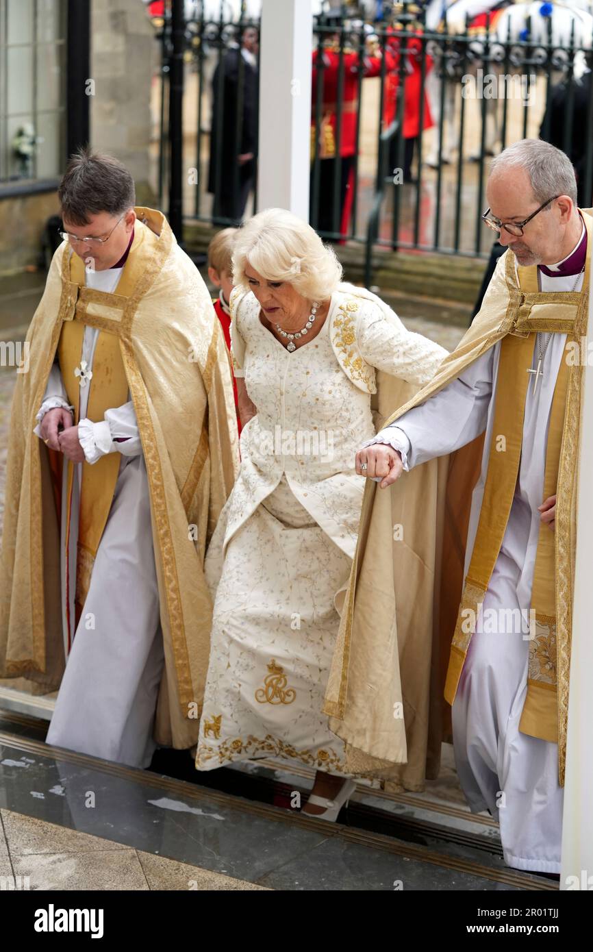 Camilla, the Queen Consort, center, arrives for her coronation ceremony ...