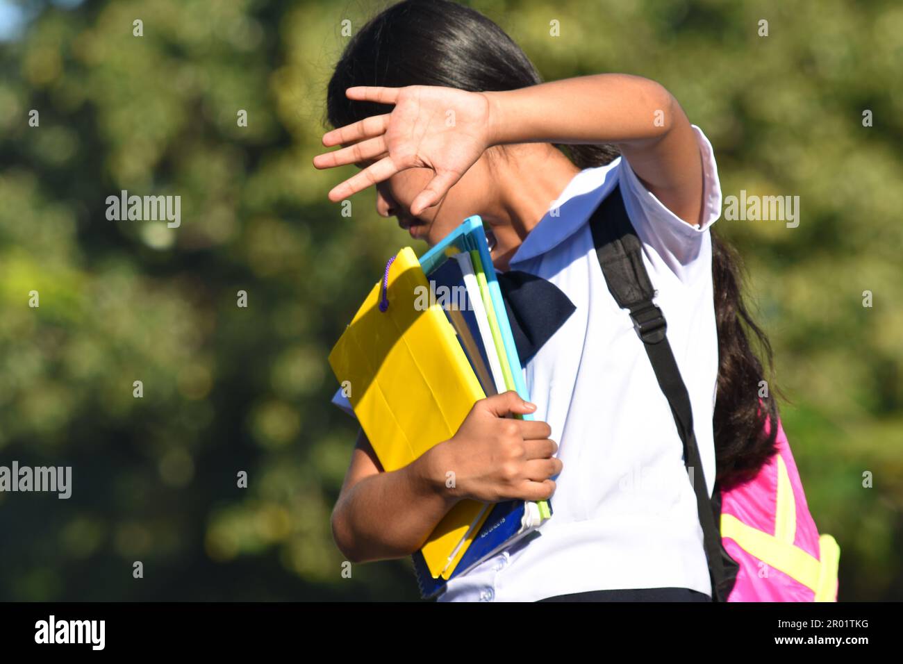 Beautiful Female Student And Fear Wearing Uniform Stock Photo - Alamy