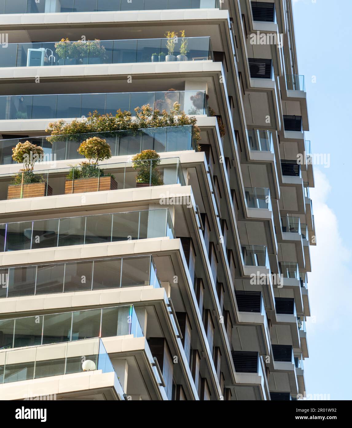 Trees on the terraces of an apartment building, green environment in ...