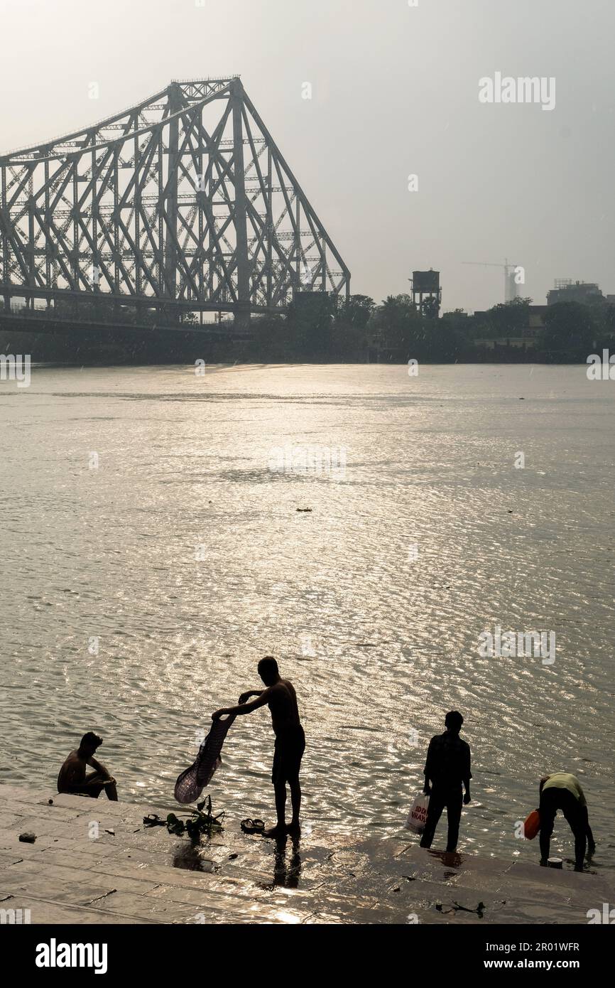 People doing various activities at the ghat of the holy river Ganga ...