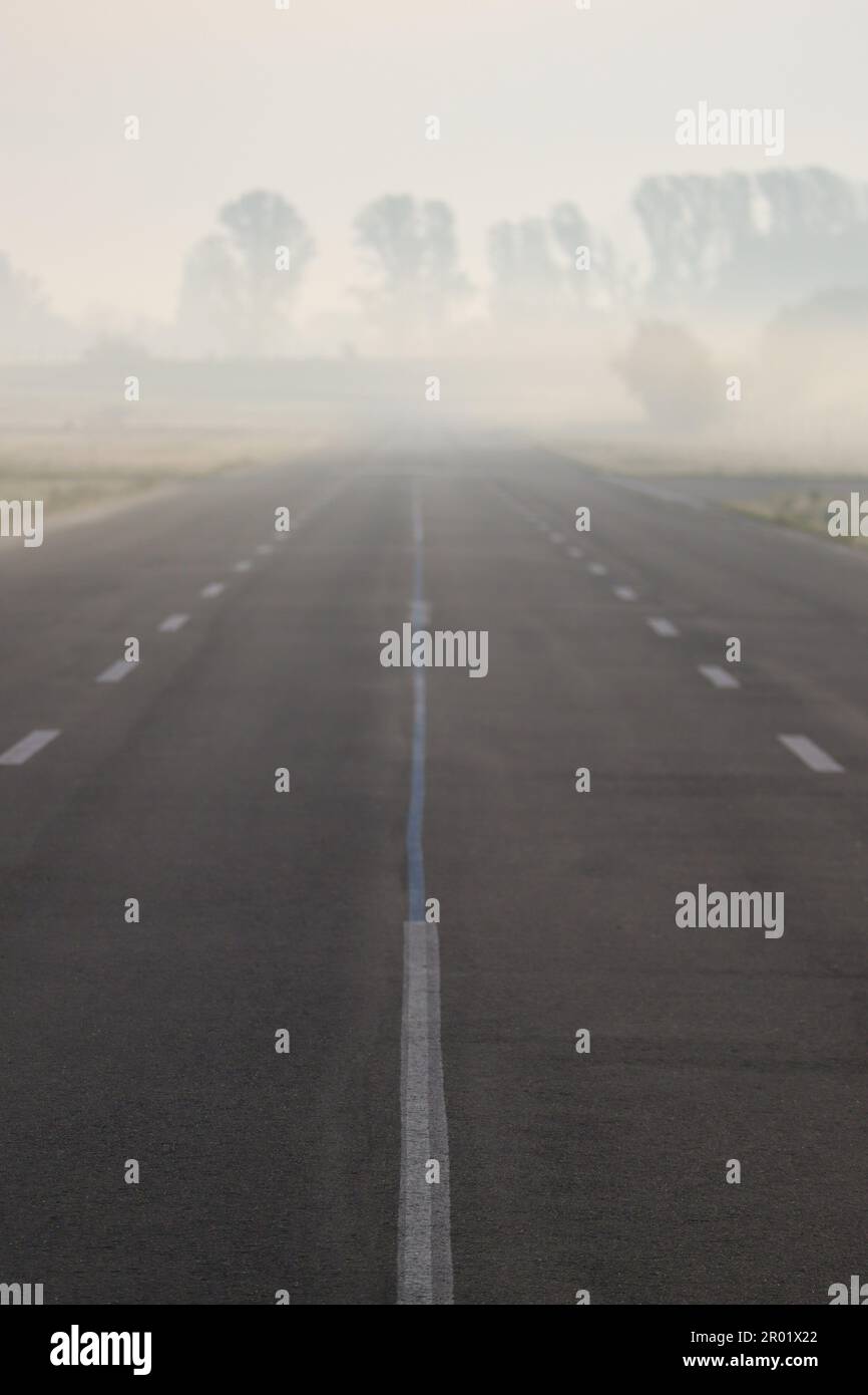 Runway leading into the Fog Stock Photo - Alamy