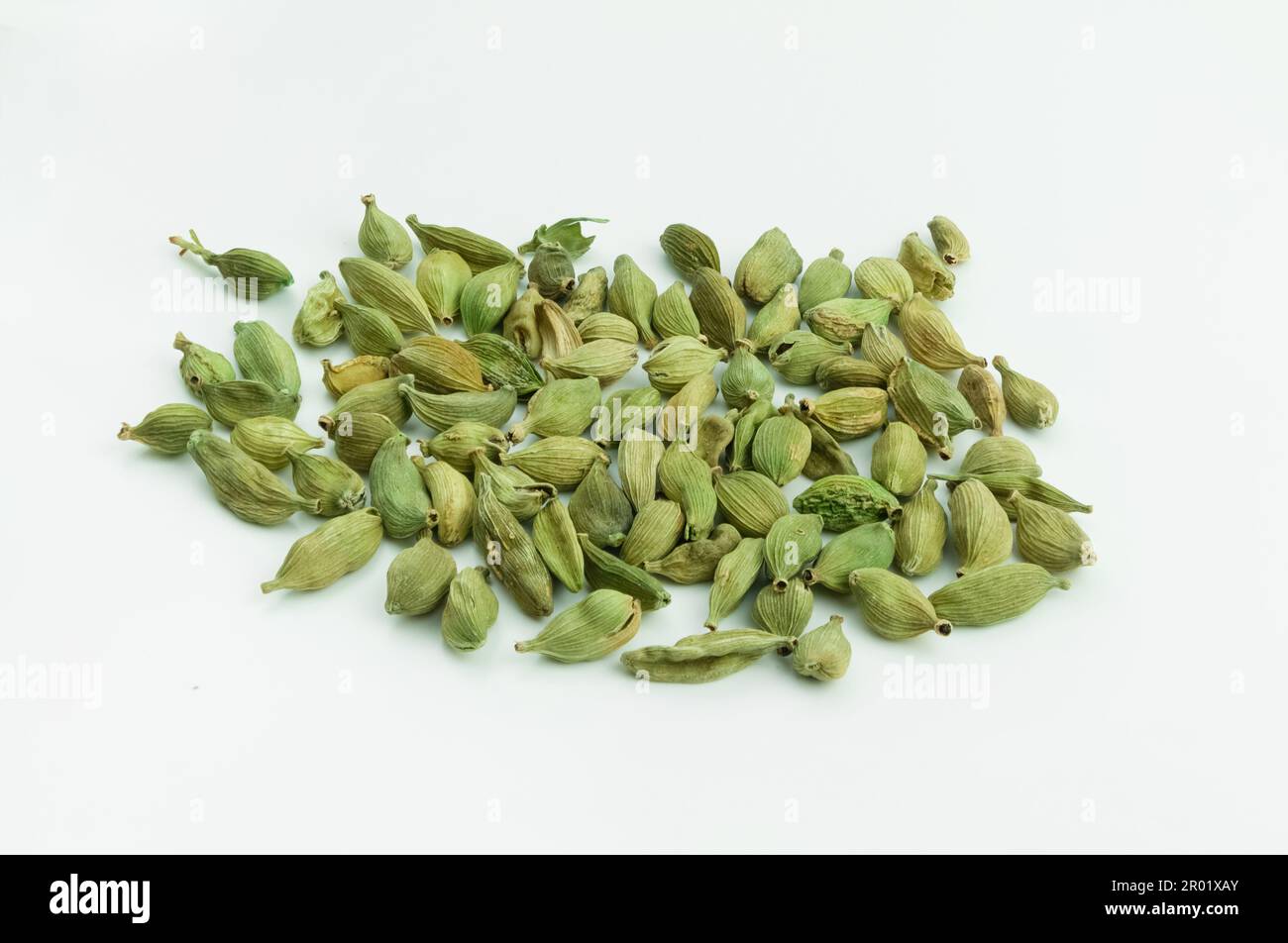 cardamom seeds isolated on white background Stock Photo - Alamy