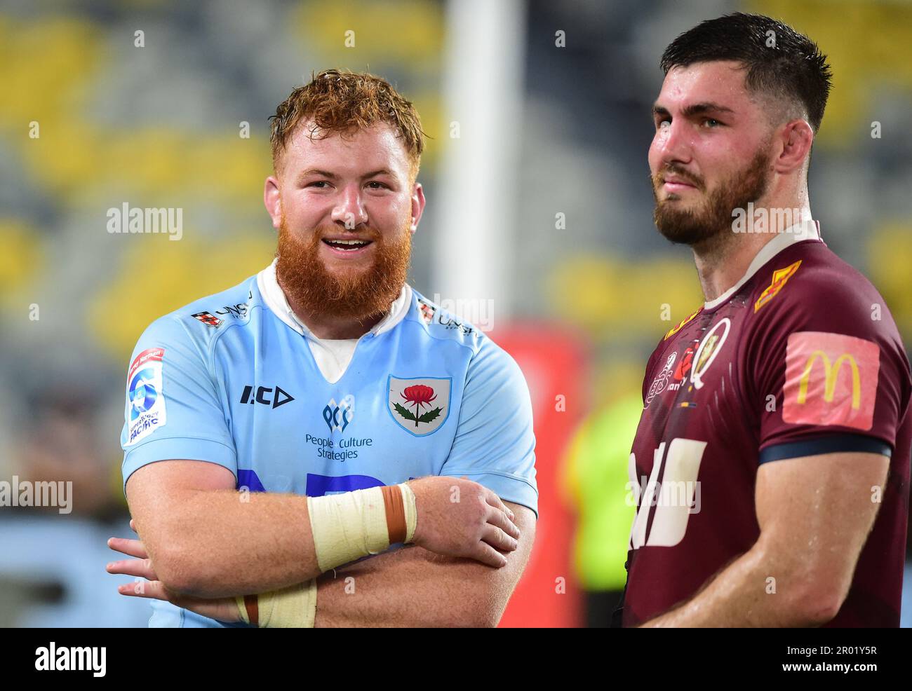 Harry Johnson-Holmes of the Waratahs and Liam Wright of the Reds chat after the Super Rugby ...